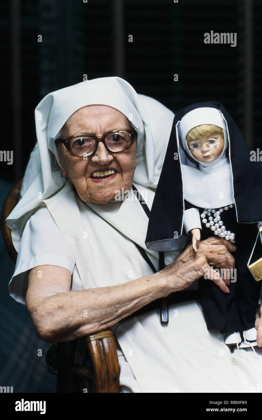 Woman holding old doll hi-res stock photography and images - Alamy