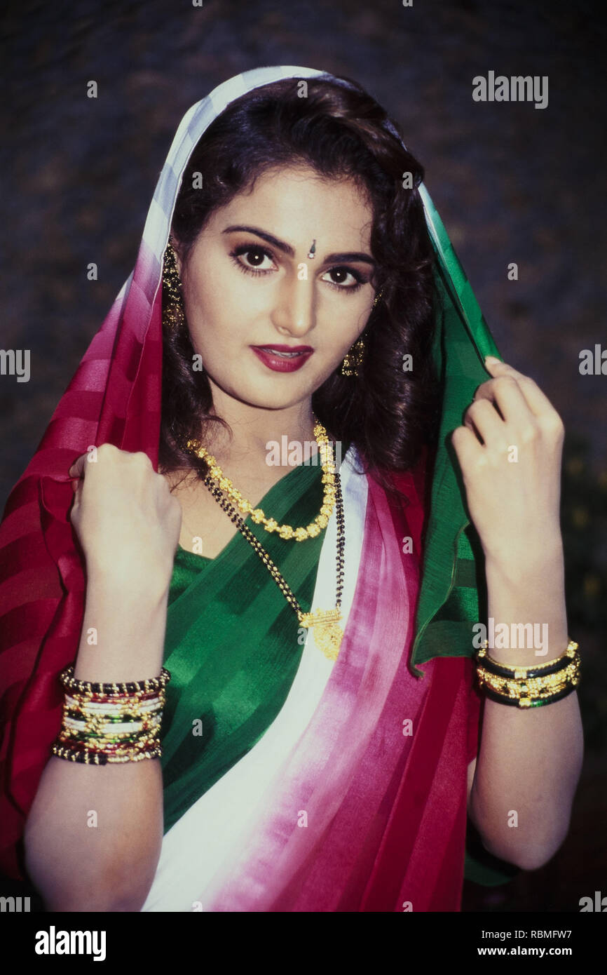 Portrait of Monika Bedi holding sari, India, Asia Stock Photo - Alamy