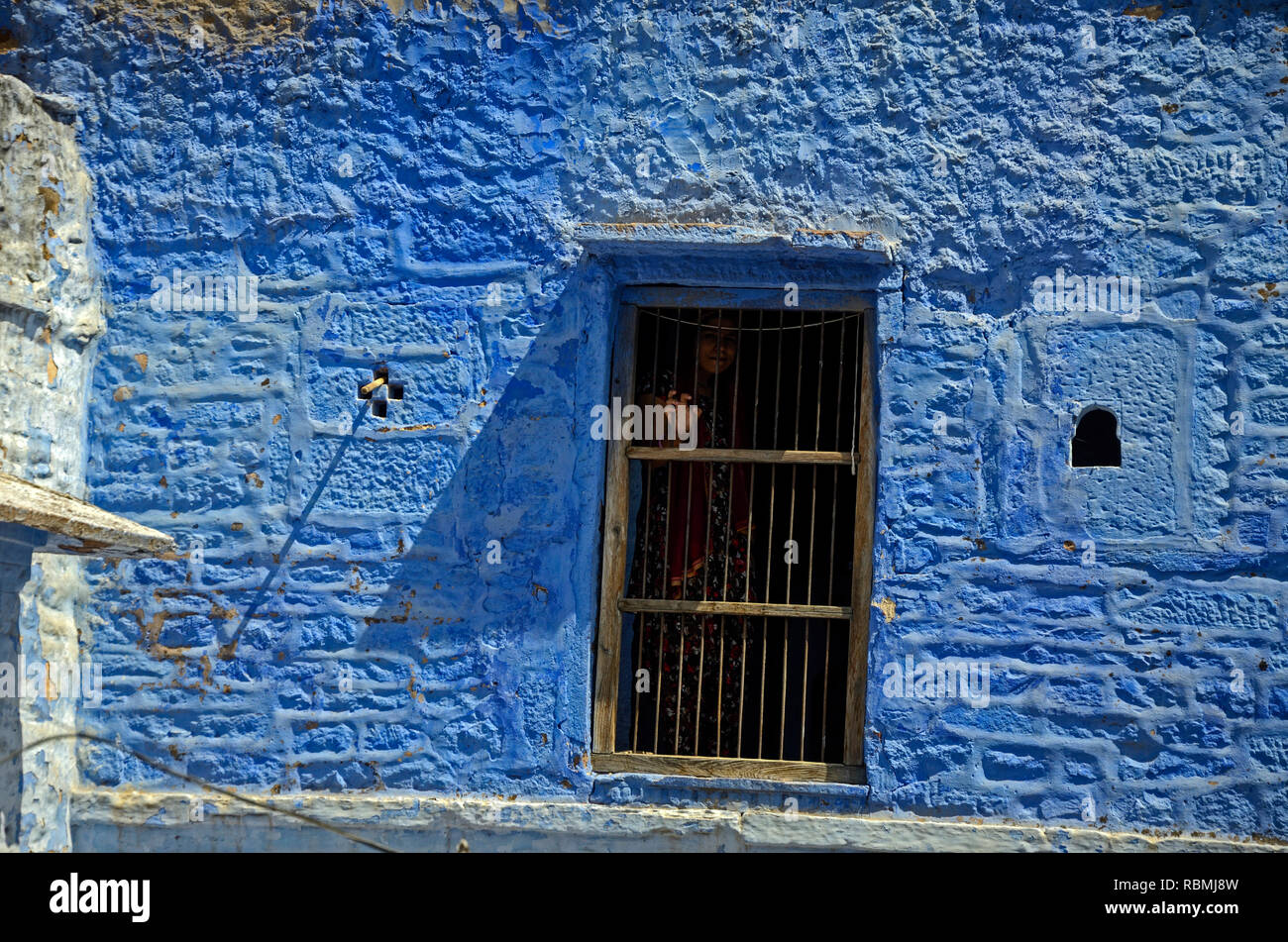 Woman peeping through house window, Jodhpur, Rajasthan, India, Asia ...