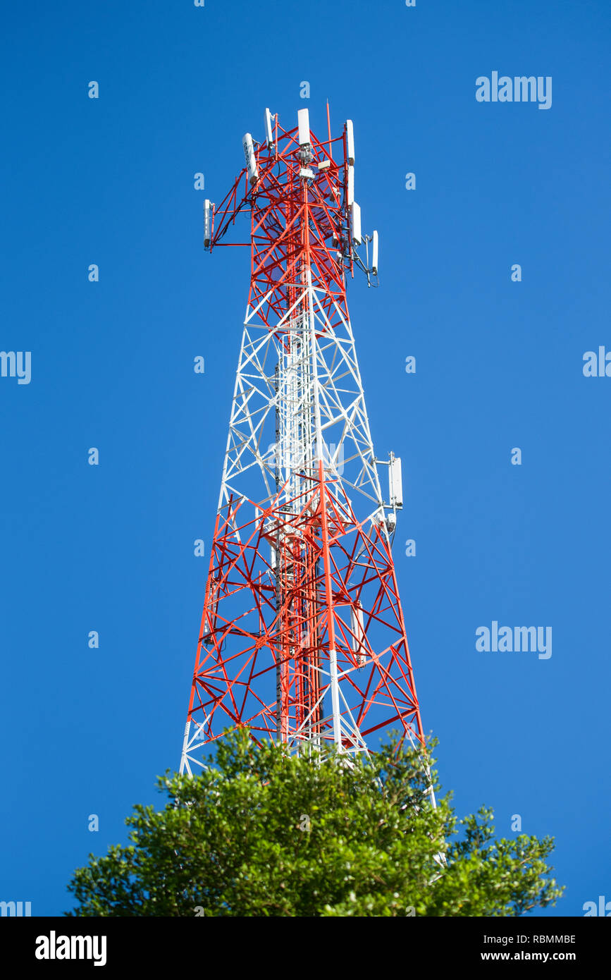 telecommunications towers with and blue sky on bright day / Satellite antennas towers wireless ...
