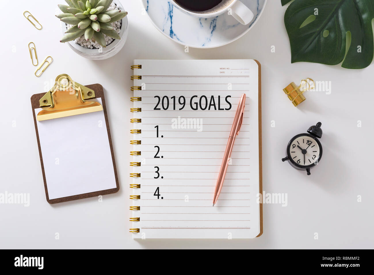 2019 Goal list on notebook, pen and clipboard on white desk Stock Photo ...