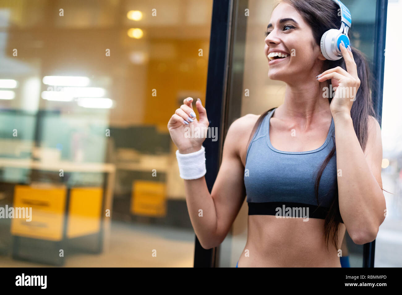 Portrait of happy fit woman in city. Healthy lifestyle concept Stock ...