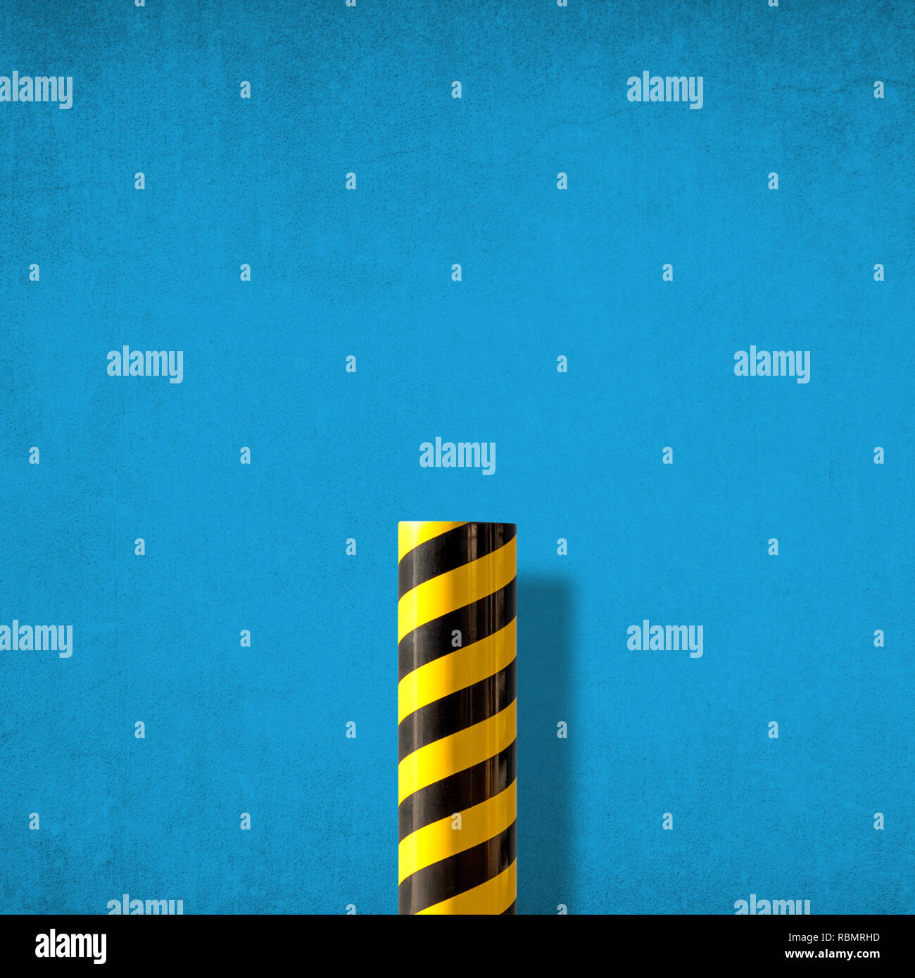 Road caution sign with diagonal yellow and black stripes against blue ...