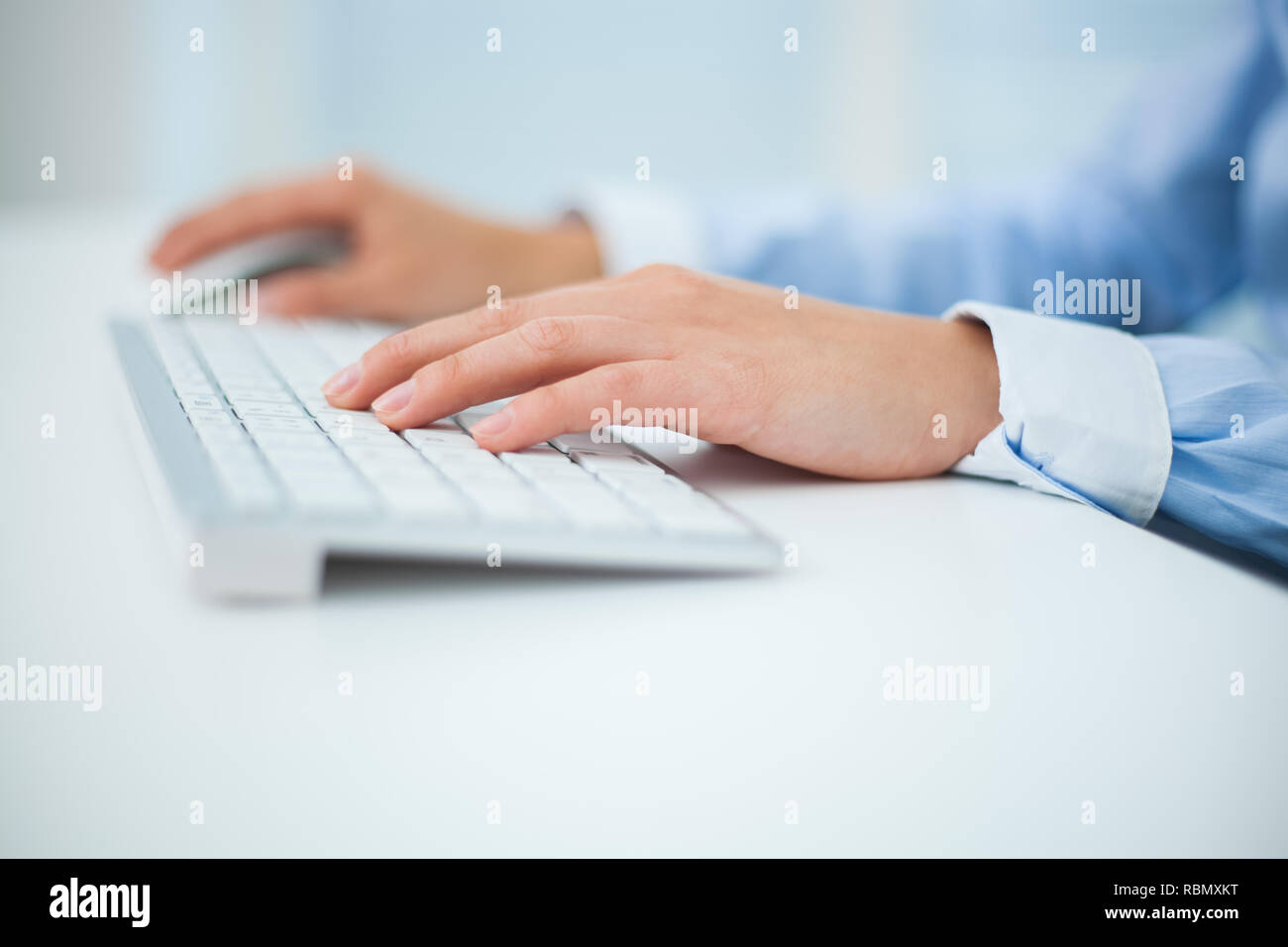 Hands of an office woman typing Stock Photo - Alamy