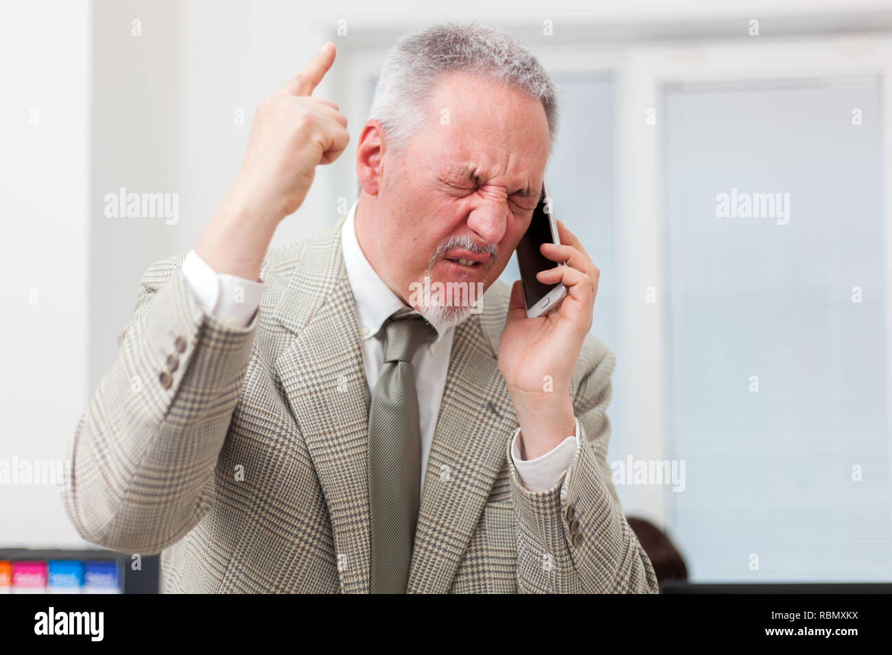 Portrait of an angry businessman yelling at phone Stock Photo - Alamy
