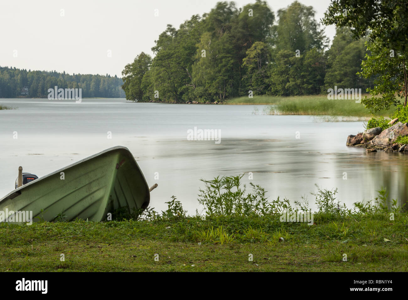 rowing boat on lakeside at big lake Stock Photo - Alamy