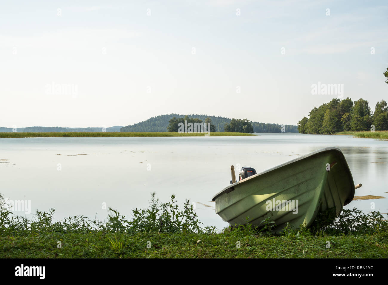 rowing boat on lakeside at big lake Stock Photo - Alamy