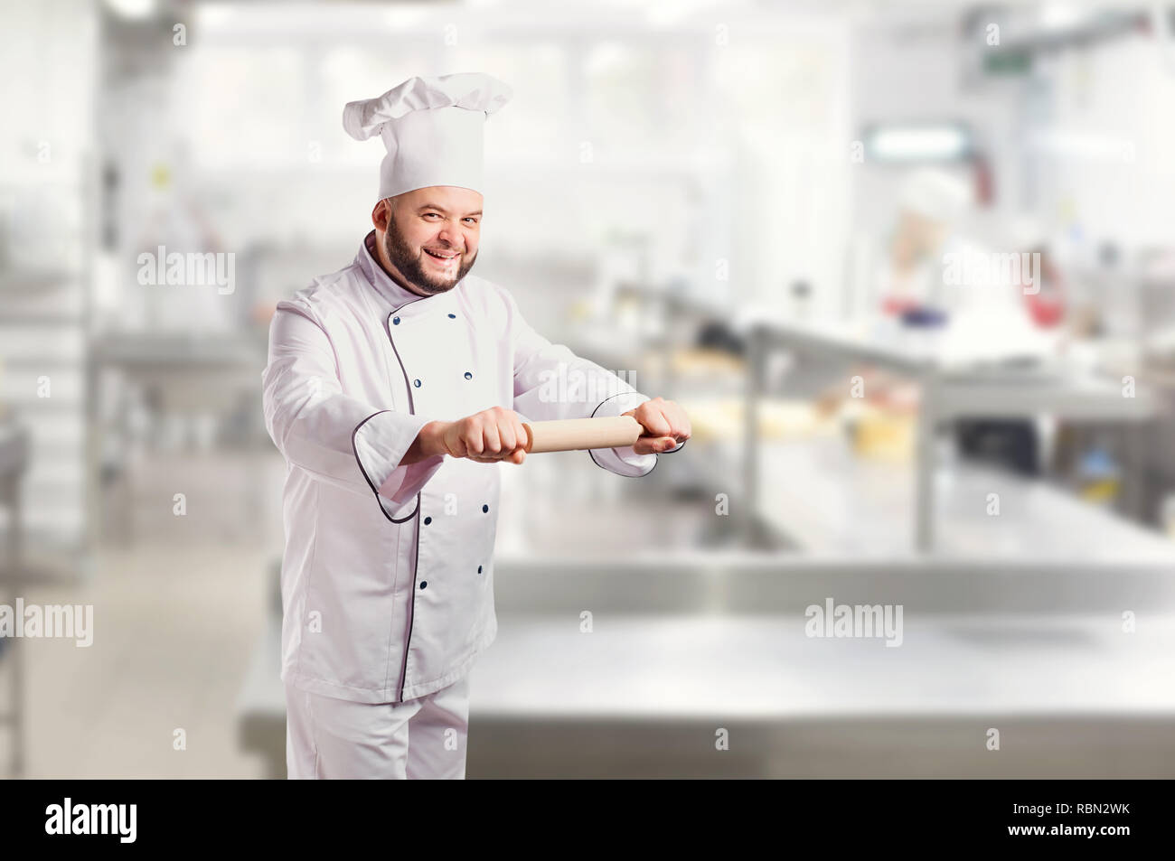 Funny cheerful chef in white uniform on a background for text Stock ...