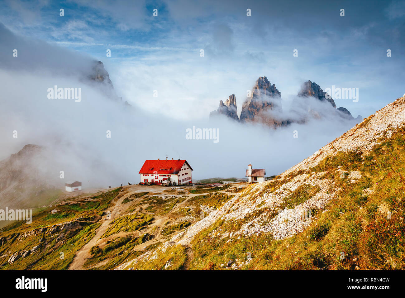 Foggy view of the National park Tre Cime di Lavaredo with rifugio ...