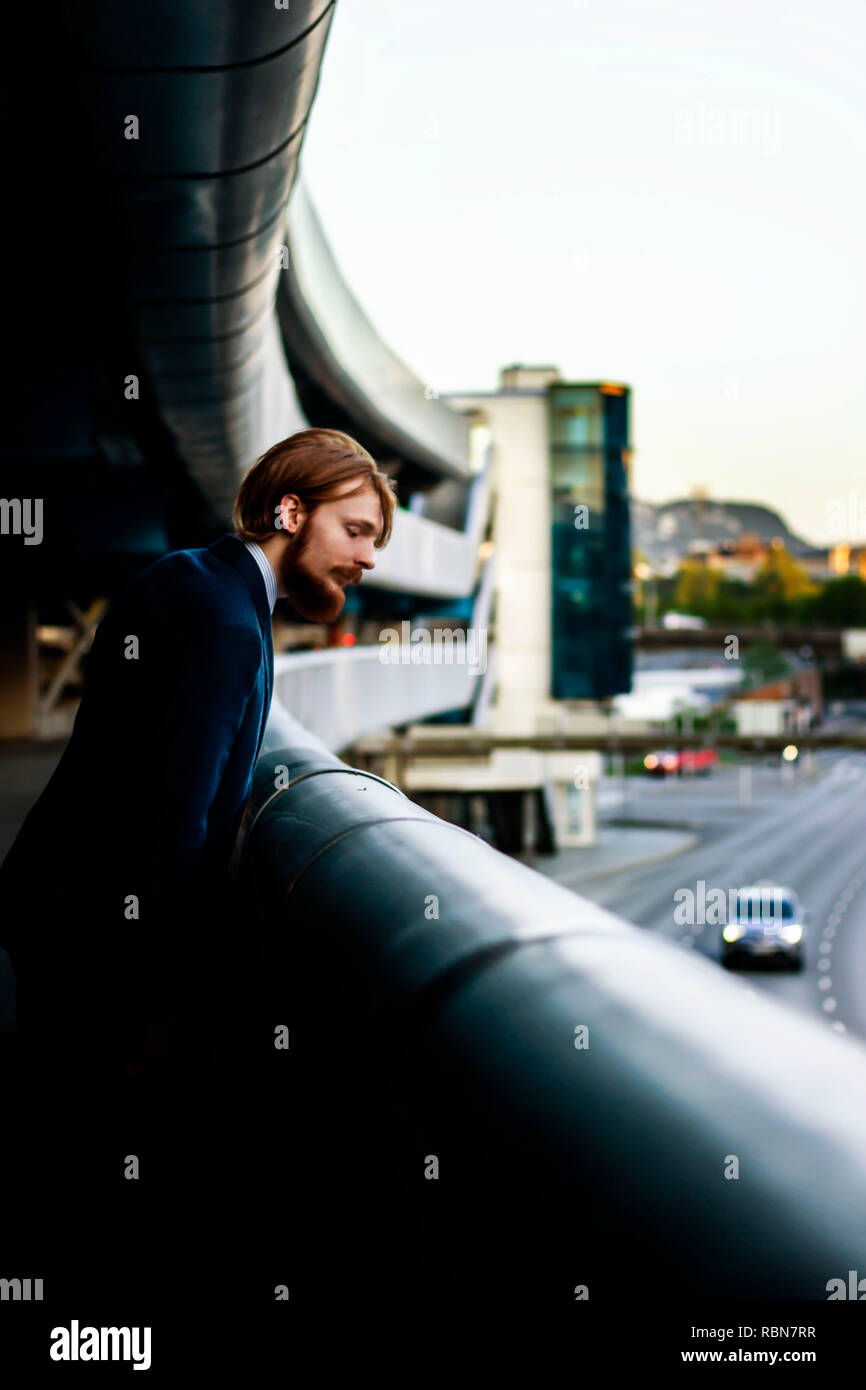 a man looking down at cars Stock Photo - Alamy