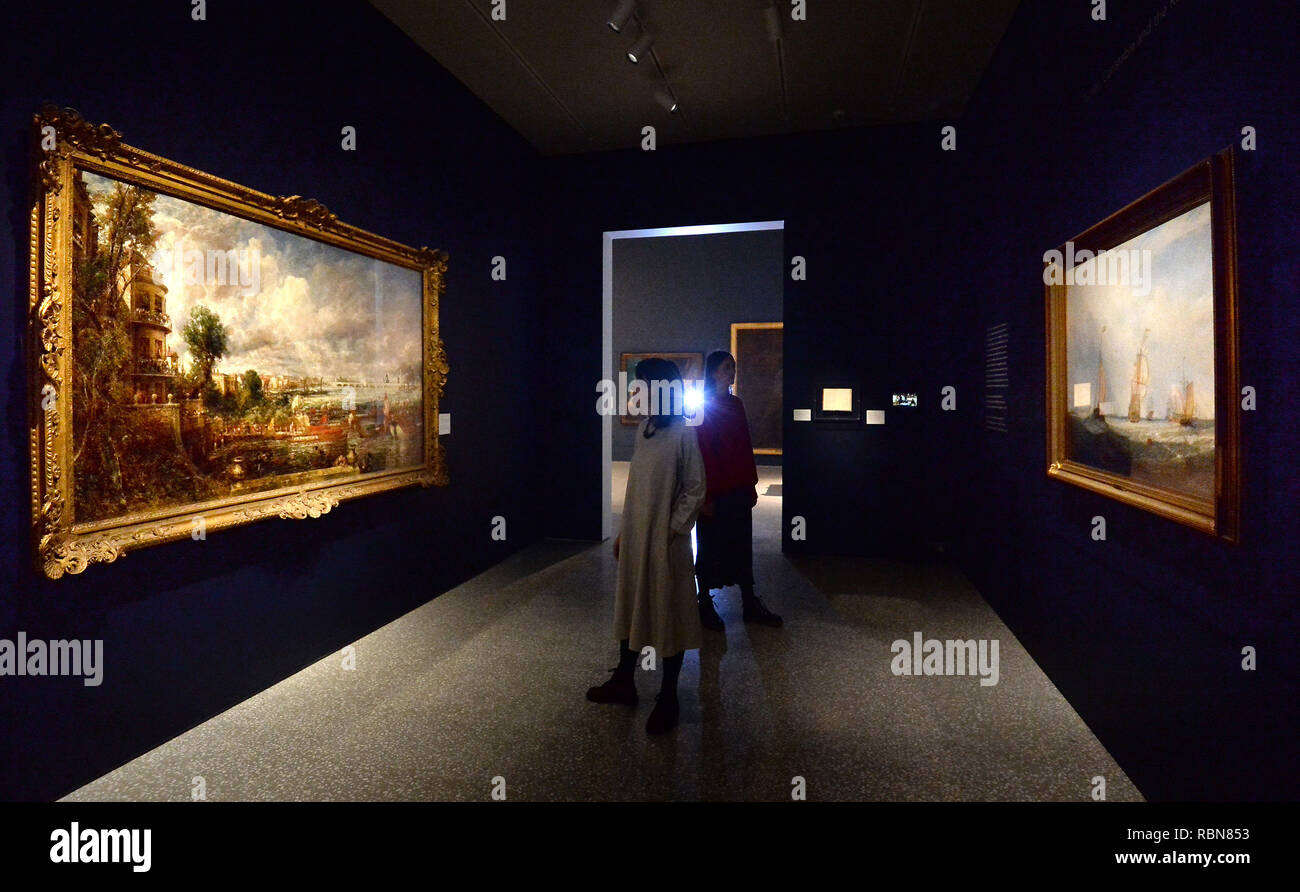 Gallery assistants with The Opening of Waterloo Bridge by John ...