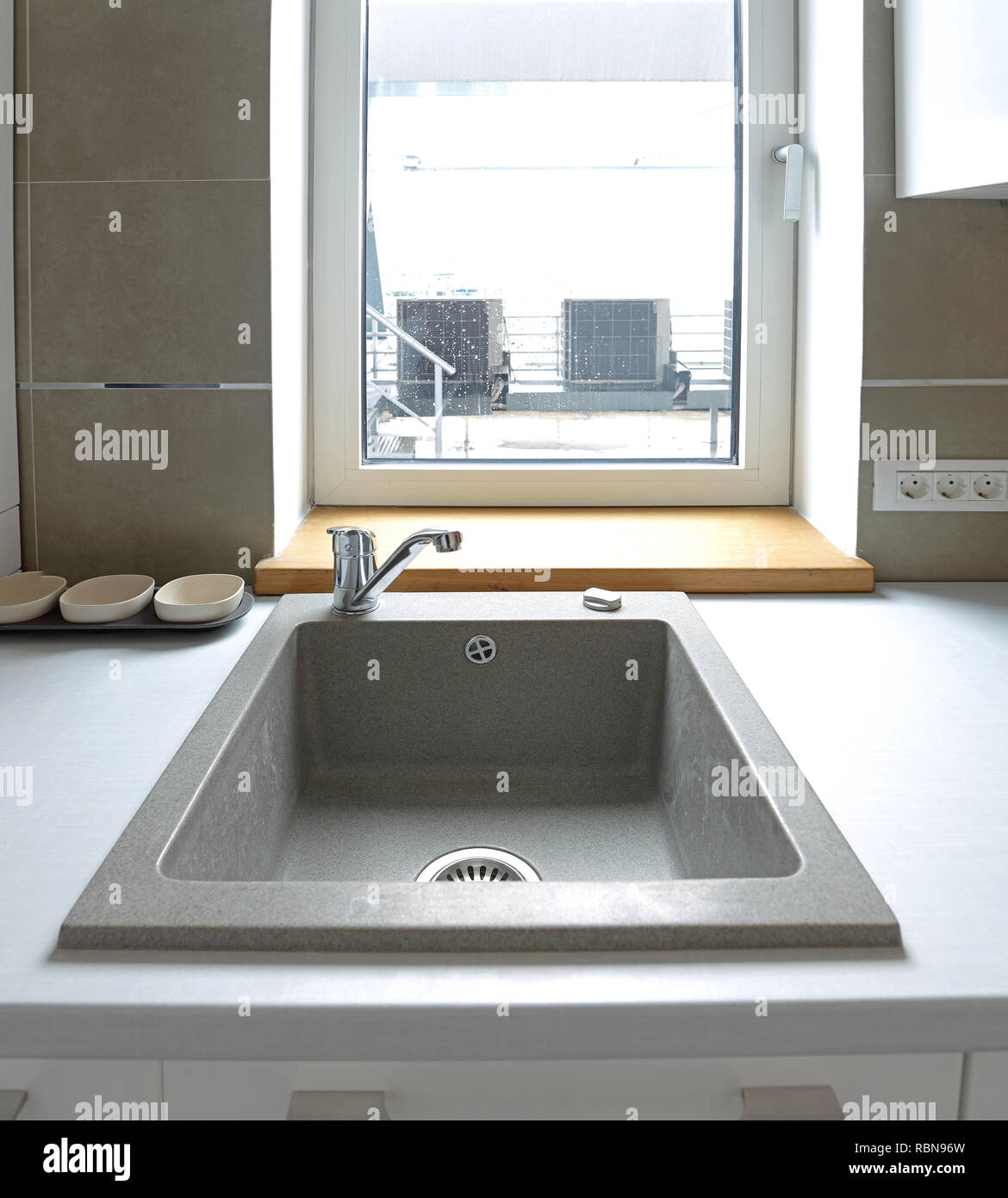 Square Quartz Composite Sink in Contemporary Kitchen Stock Photo - Alamy