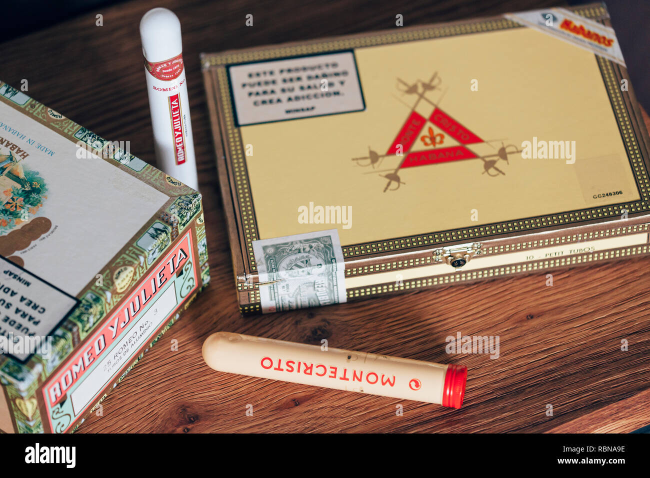 Cuban cigar boxes and individual cigar tubes on table Stock Photo - Alamy