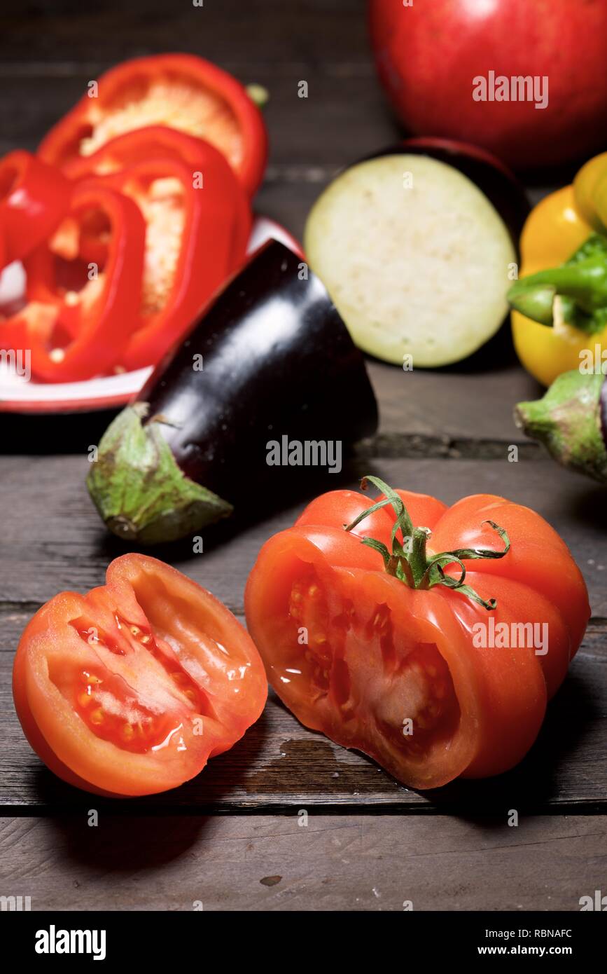 Vegetables on a wood table Stock Photo - Alamy