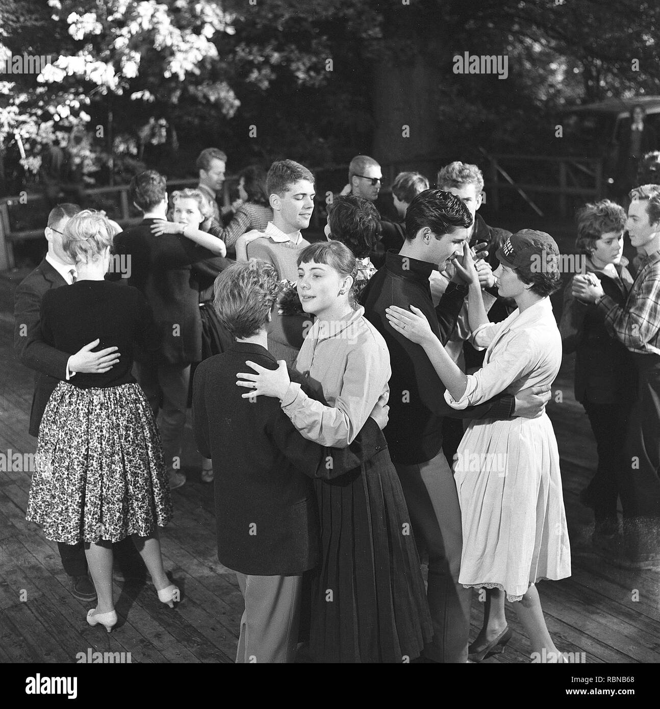 Group of teenagers having fun outdoors Black and White Stock Photos ...