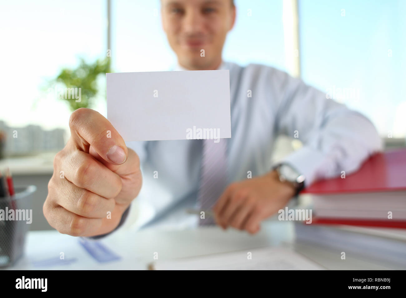 Male arm in suit give blank calling card Stock Photo - Alamy