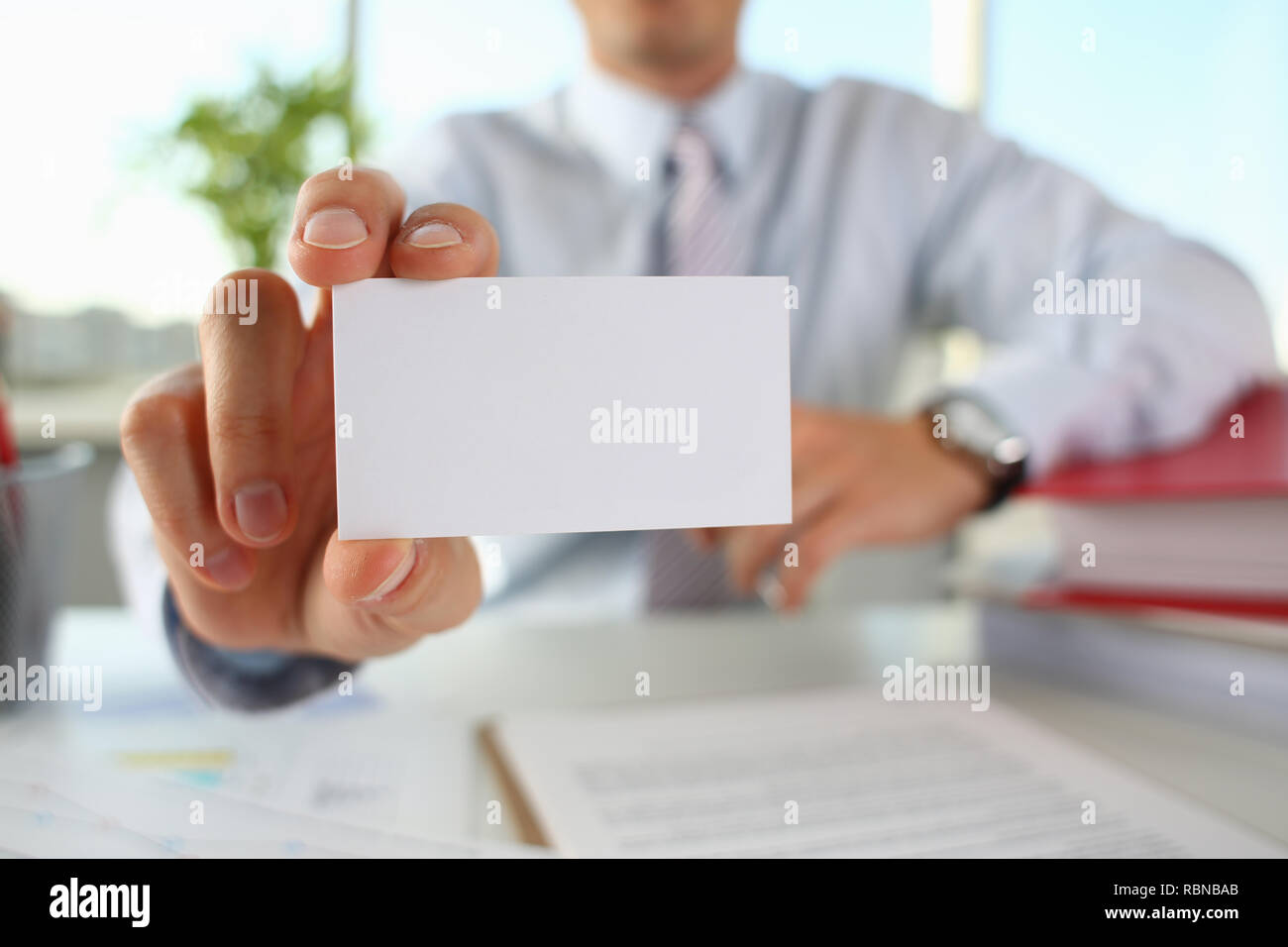 Male arm in suit give blank calling card Stock Photo - Alamy