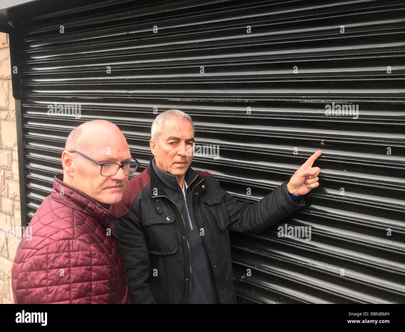 West Belfast MP Paul Maskey (left) and Sinn Fein MLA Pat Sheehan point ...