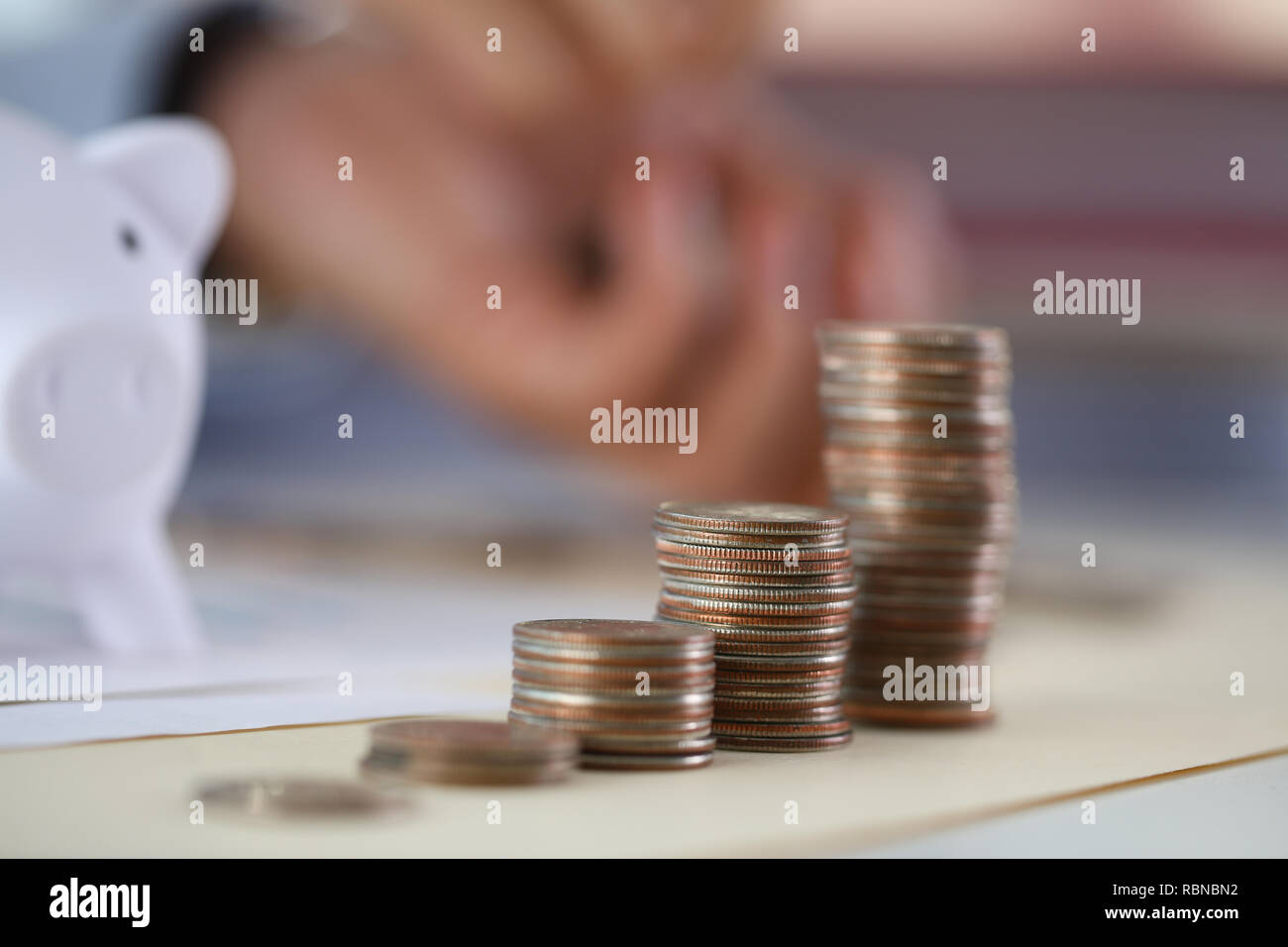 Hand businessman putting pin money Stock Photo - Alamy