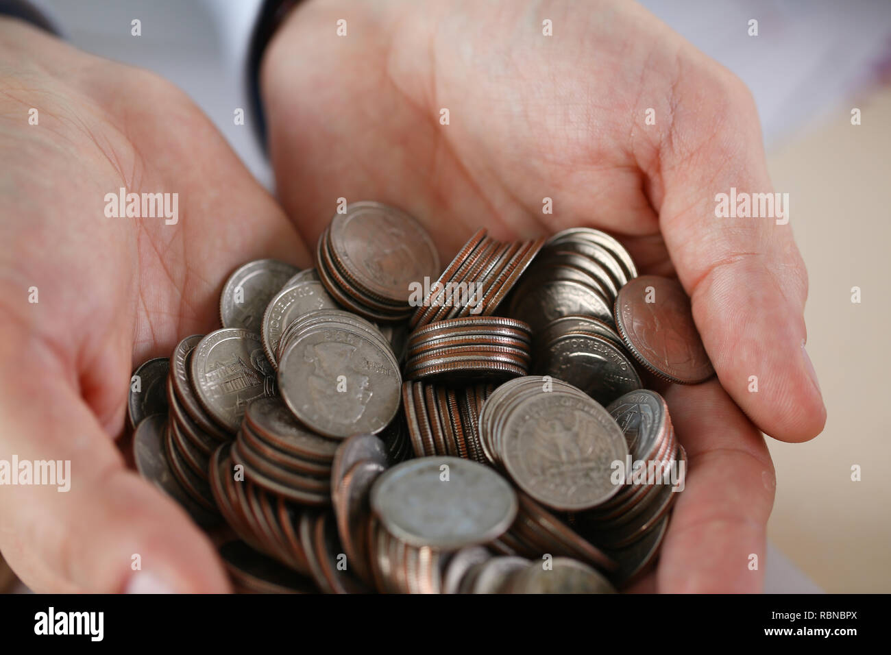 Hand businessman putting pin money Stock Photo - Alamy