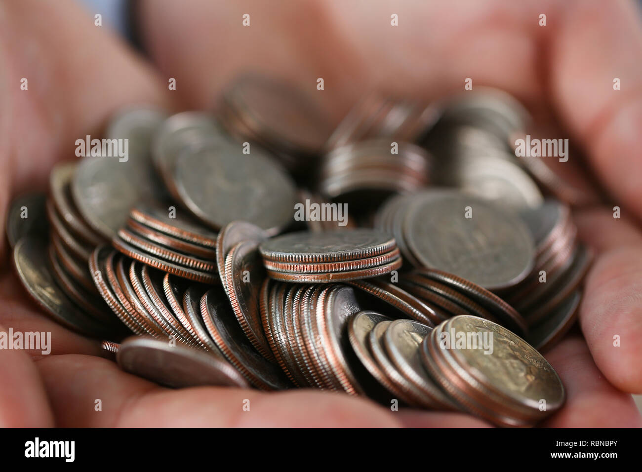 Hand businessman putting pin money Stock Photo - Alamy