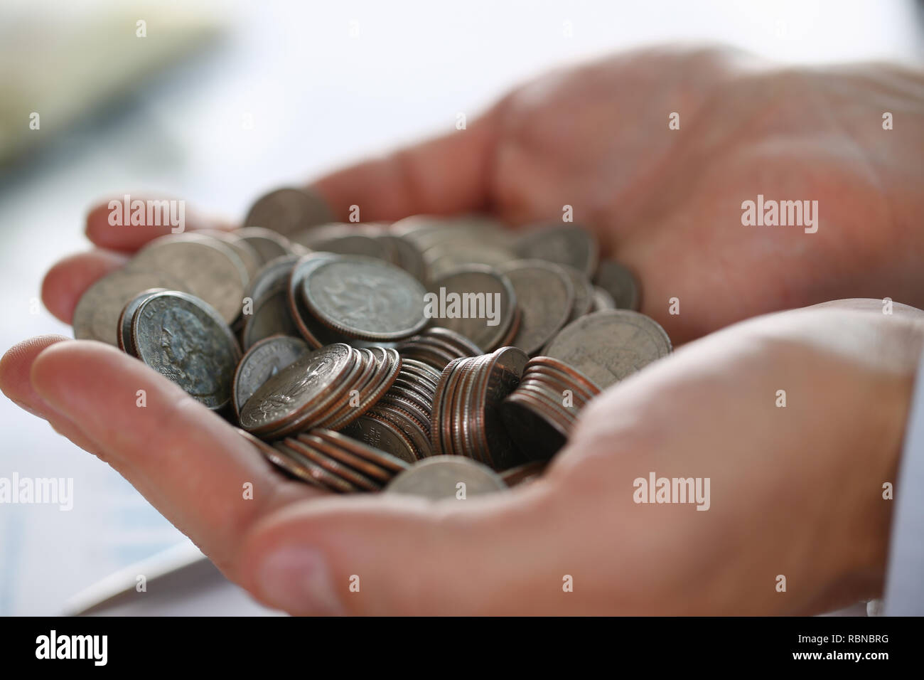 Hand businessman putting pin money Stock Photo - Alamy