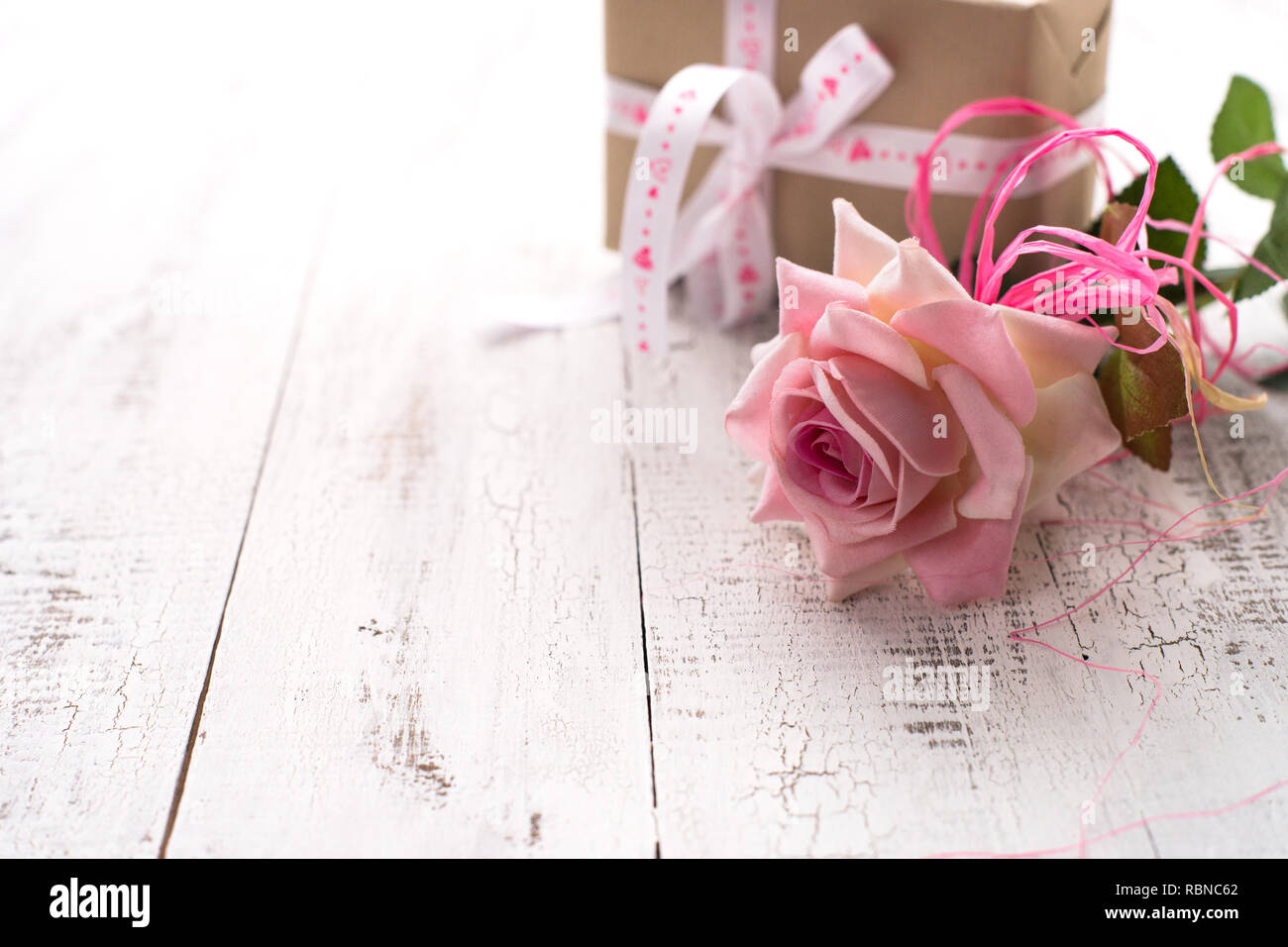 Valentines day background. Pink heart, rose and present. Love symbol ...