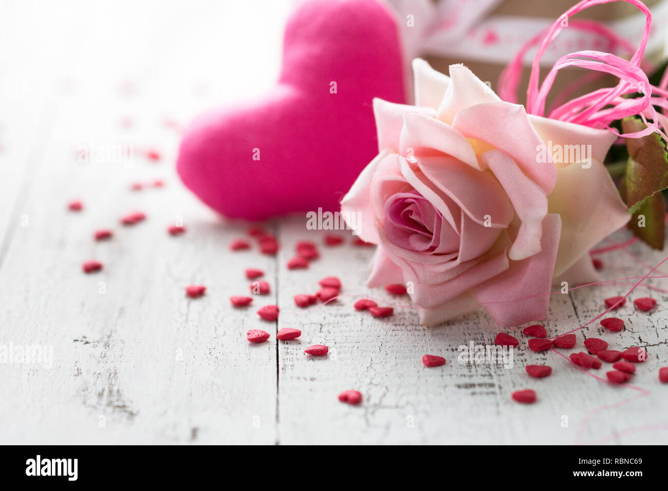 Valentines day background. Pink heart, rose and present. Love symbol ...