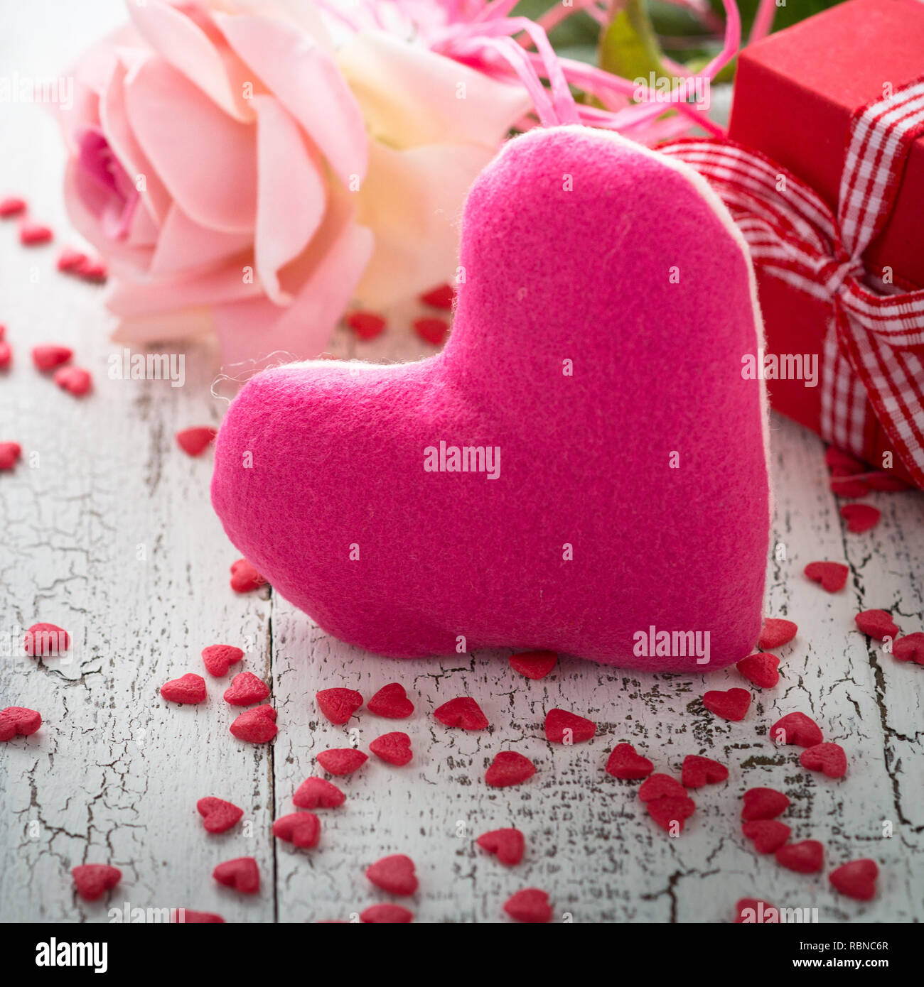 Valentines day background. Pink heart, rose and present. Love symbol ...