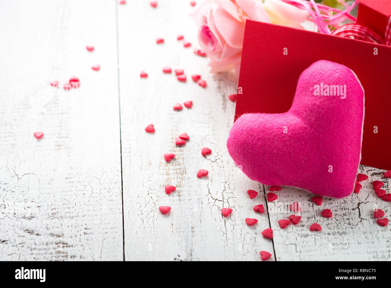 Valentines day background. Pink heart, rose and present. Love symbol ...