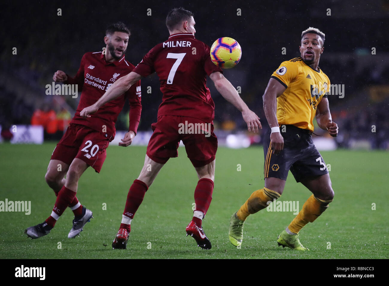 Wolverhampton Wanderers' Adama Traore (right) battles with Liverpool's ...