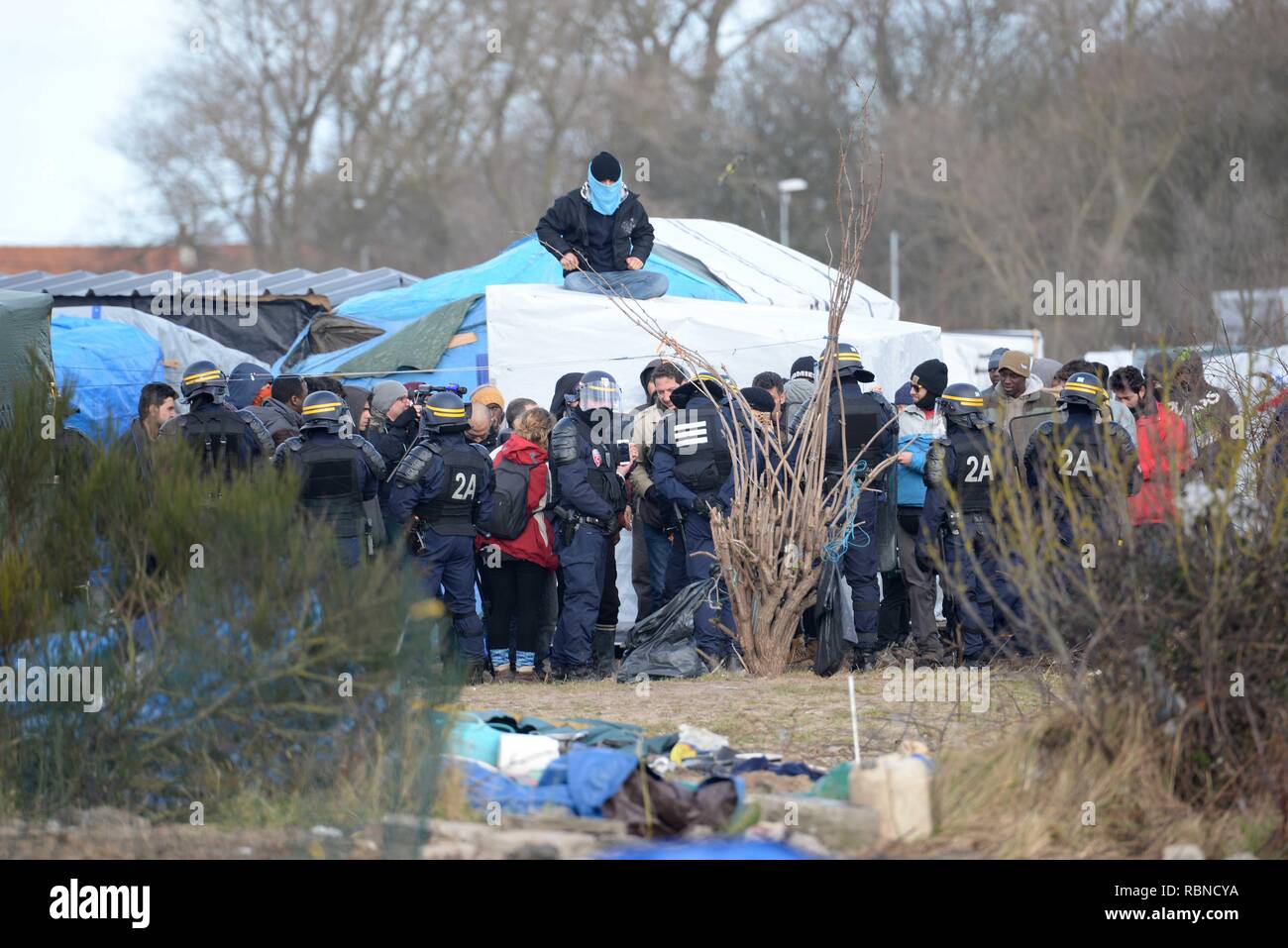 Workers begin to clear the southern section of the Calais Jungle in ...