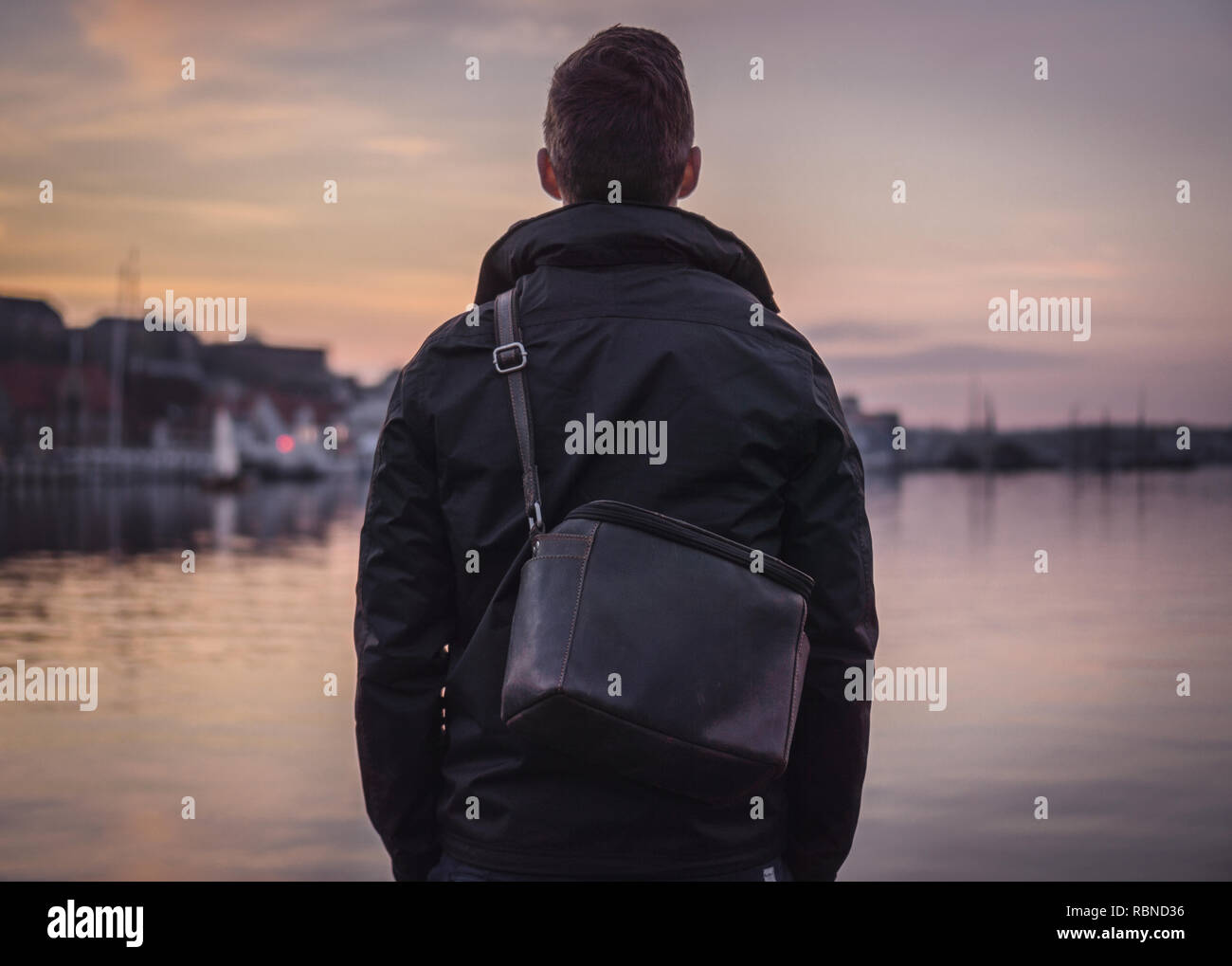 Back view young man silhouette outside hi-res stock photography and ...