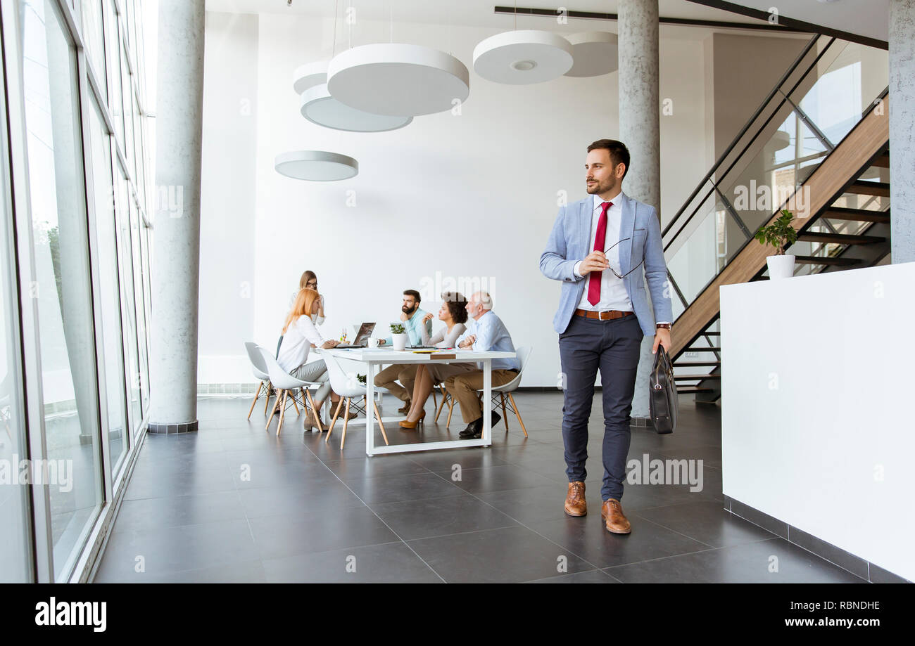 Businessman leaving office hi-res stock photography and images - Alamy