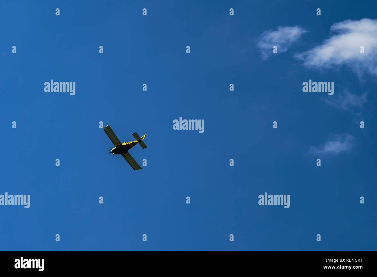 Three small aircraft flying in the sky against a background of clouds ...
