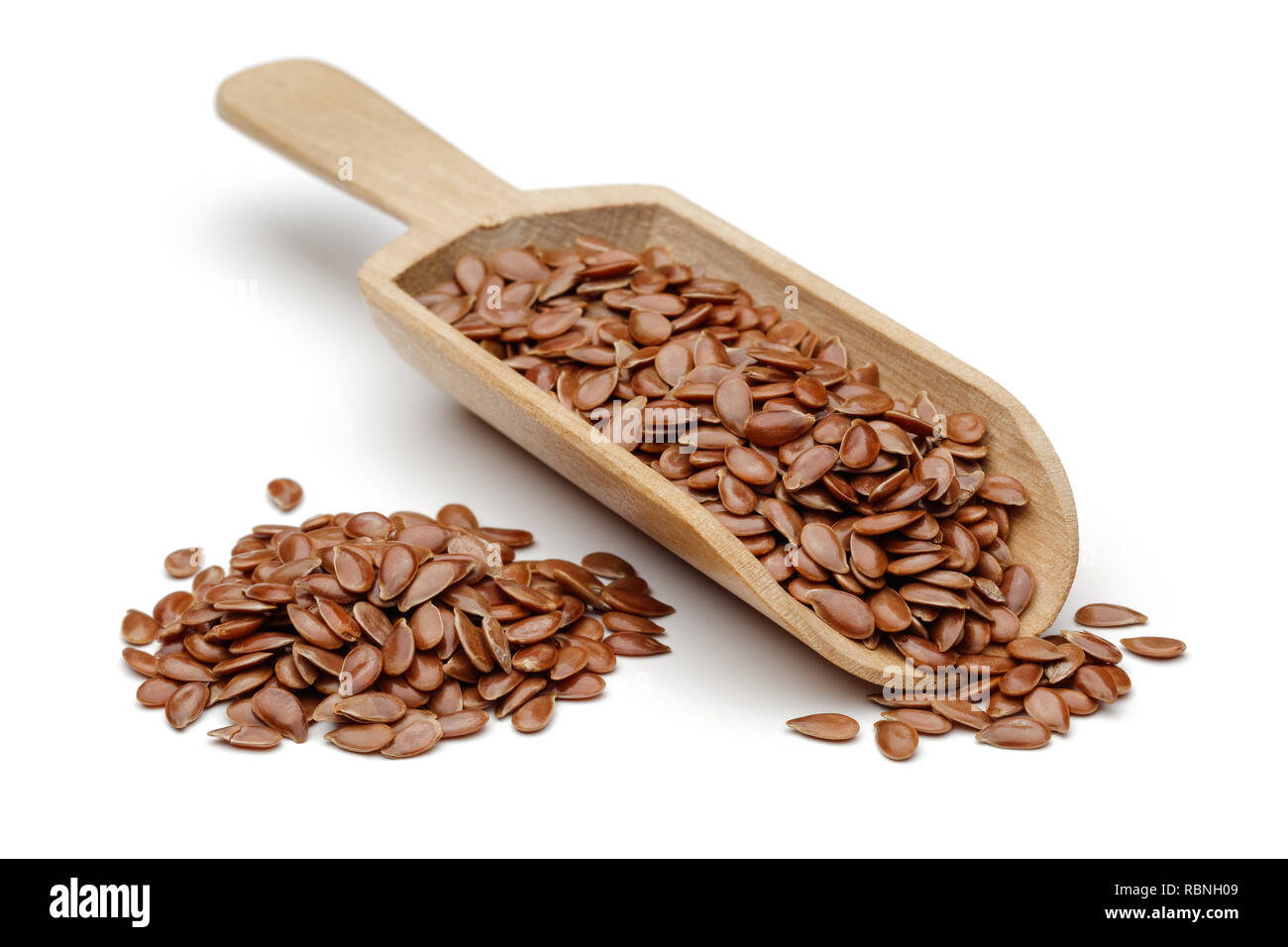 Flax seeds in wooden spoon isolated on white background Stock Photo - Alamy