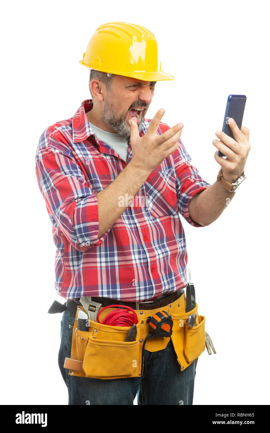 Builder screaming at phone during video call making angry gesture with ...