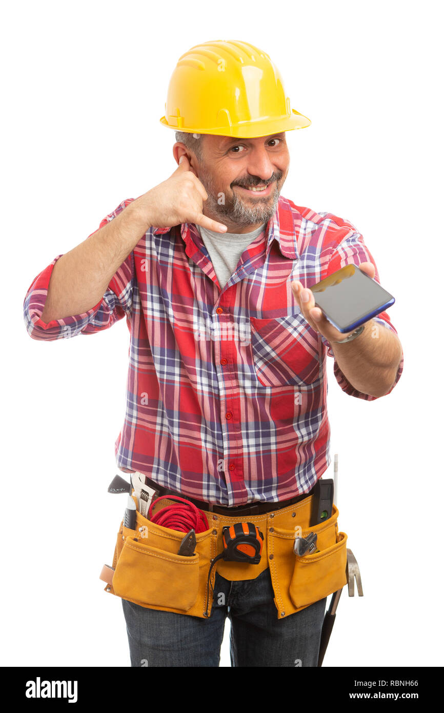 Friendly construction worker making call us gesture with fingers at ear ...