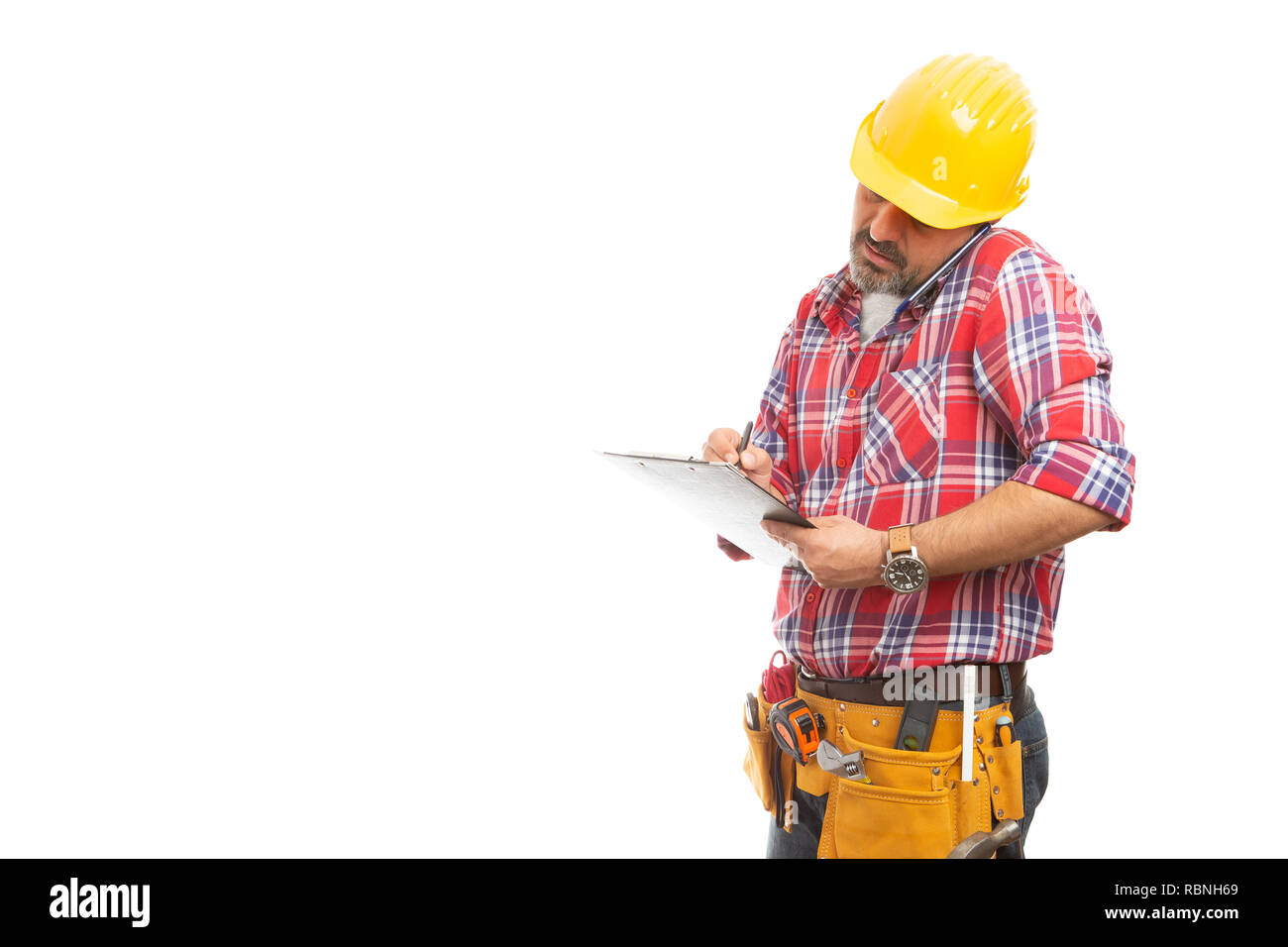 Male builder taking notes on clipboard as talking on phone isolated on ...