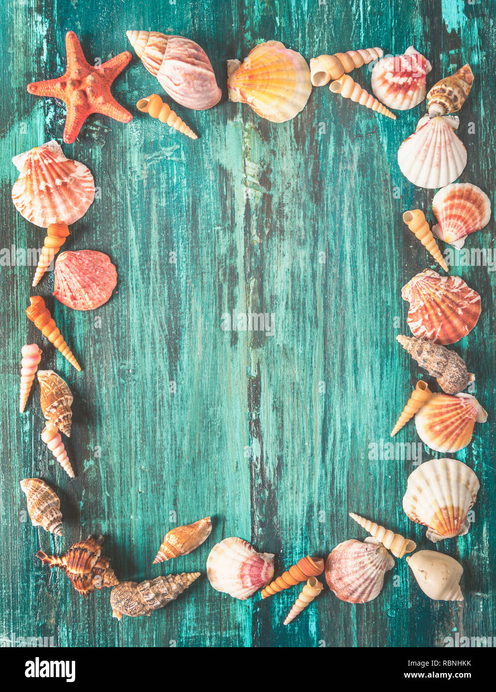 Seashell and star fish frame on rustic wooden texture background design ...