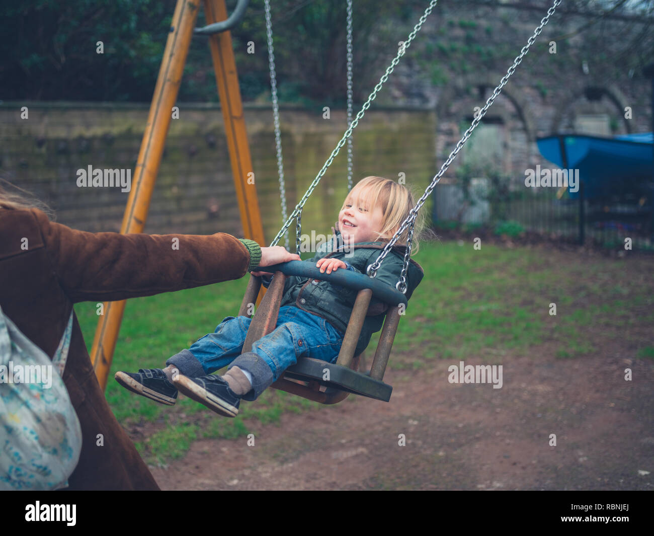Child swing push hi-res stock photography and images - Alamy