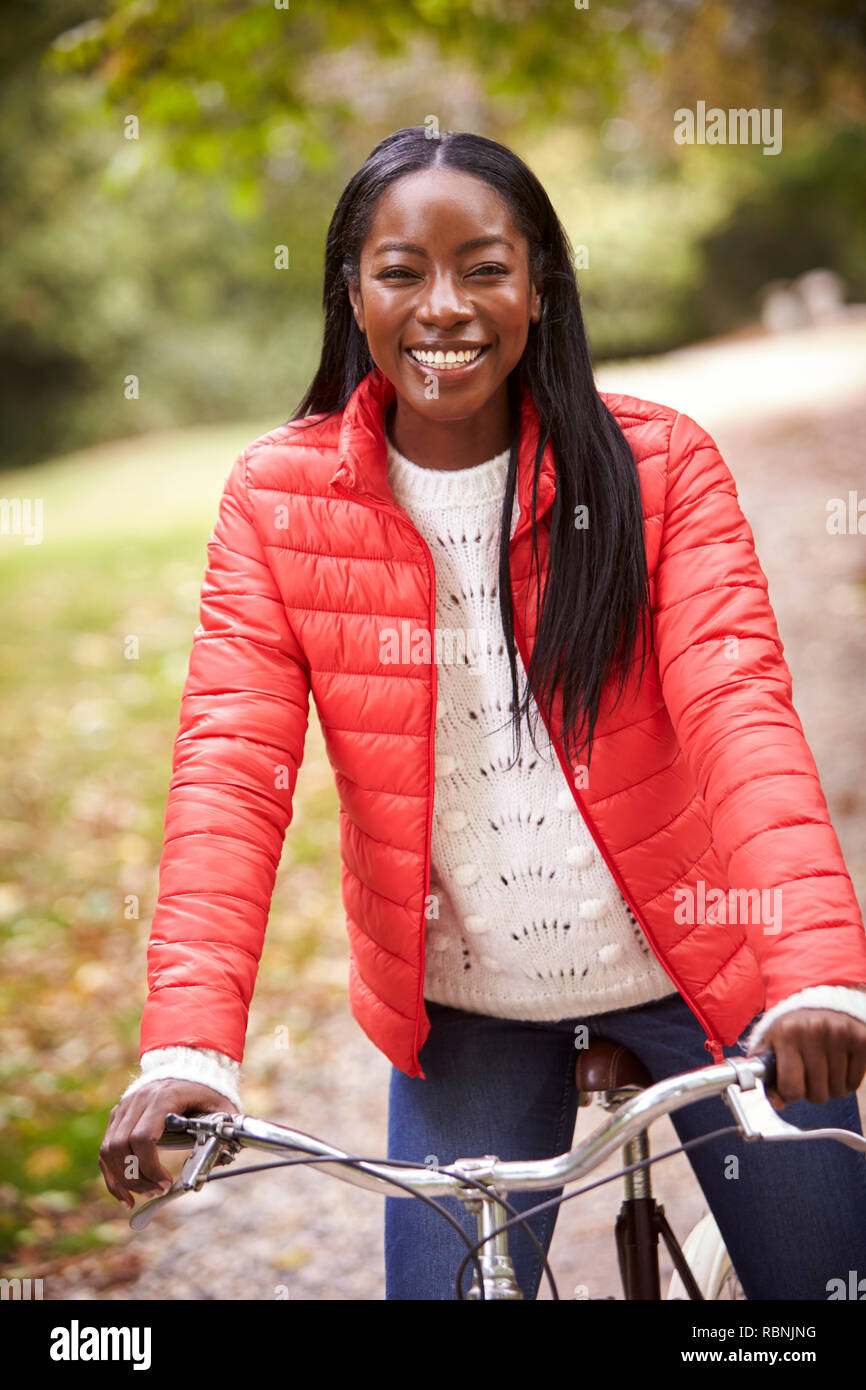 Smiling young woman on bicycle at hi-res stock photography and images ...