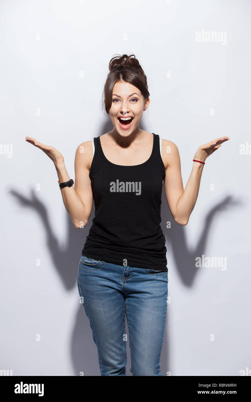 Surprised happy beautiful woman in excitement. Isolated on white ...