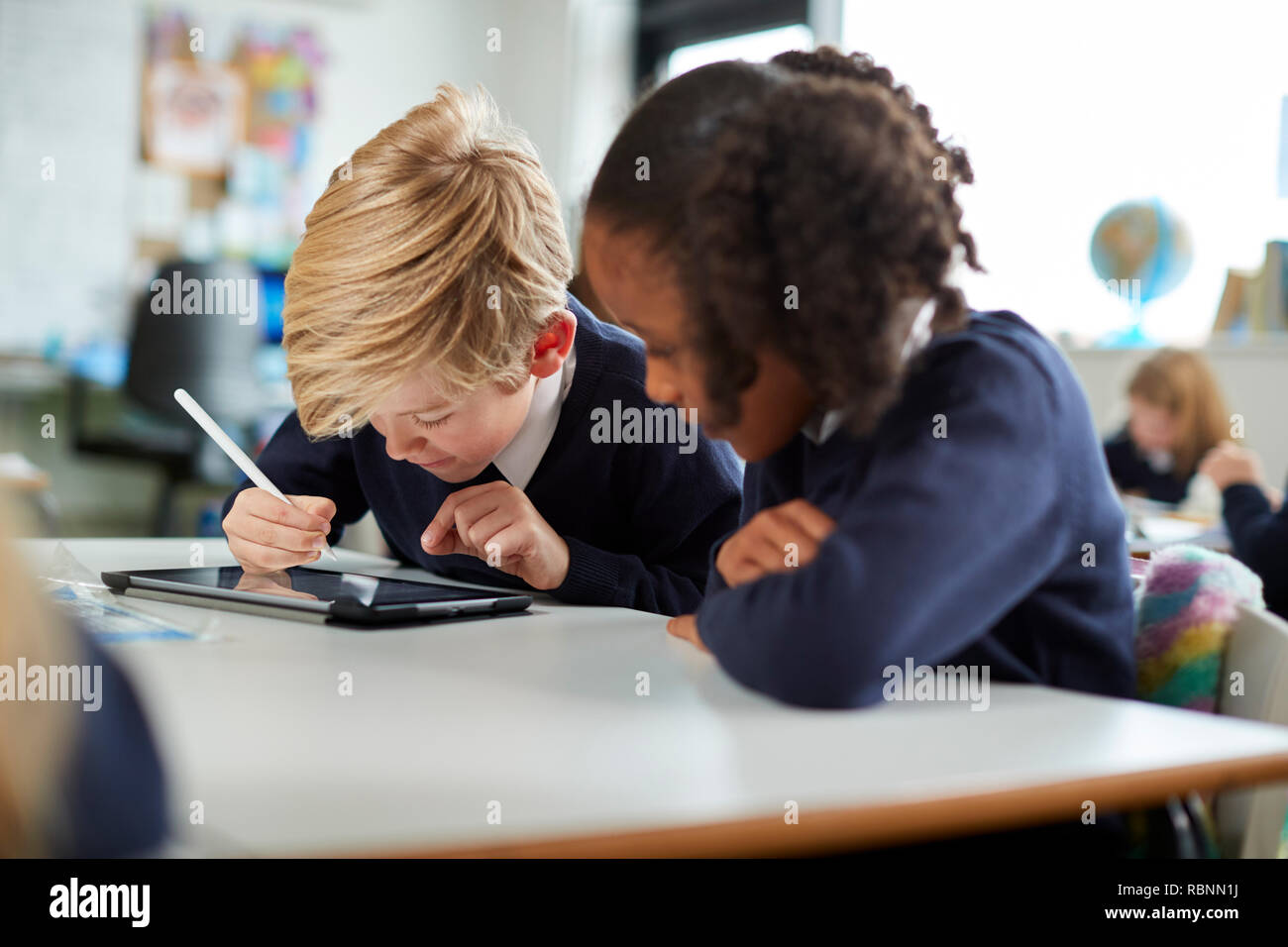 Looking closely at a computer screen hi-res stock photography and ...