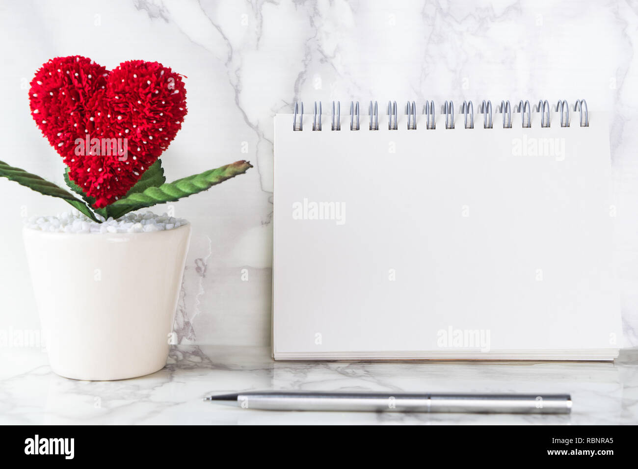 Blank empty notebook page with heart flower pot for love story concept ...
