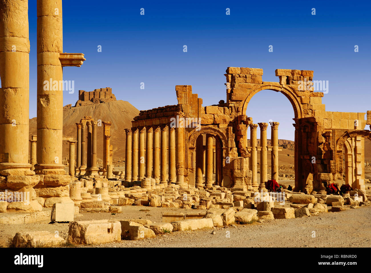 Monumental Arch and Columns and the Arab Castle. Ruins of the old Greco ...