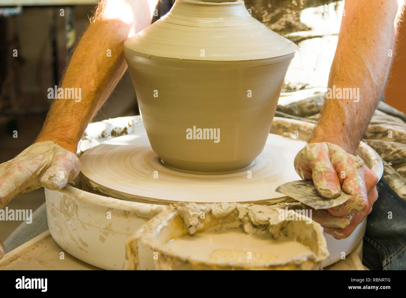 Detail of artist potter in the workshop sculpting ceramic vase Stock ...