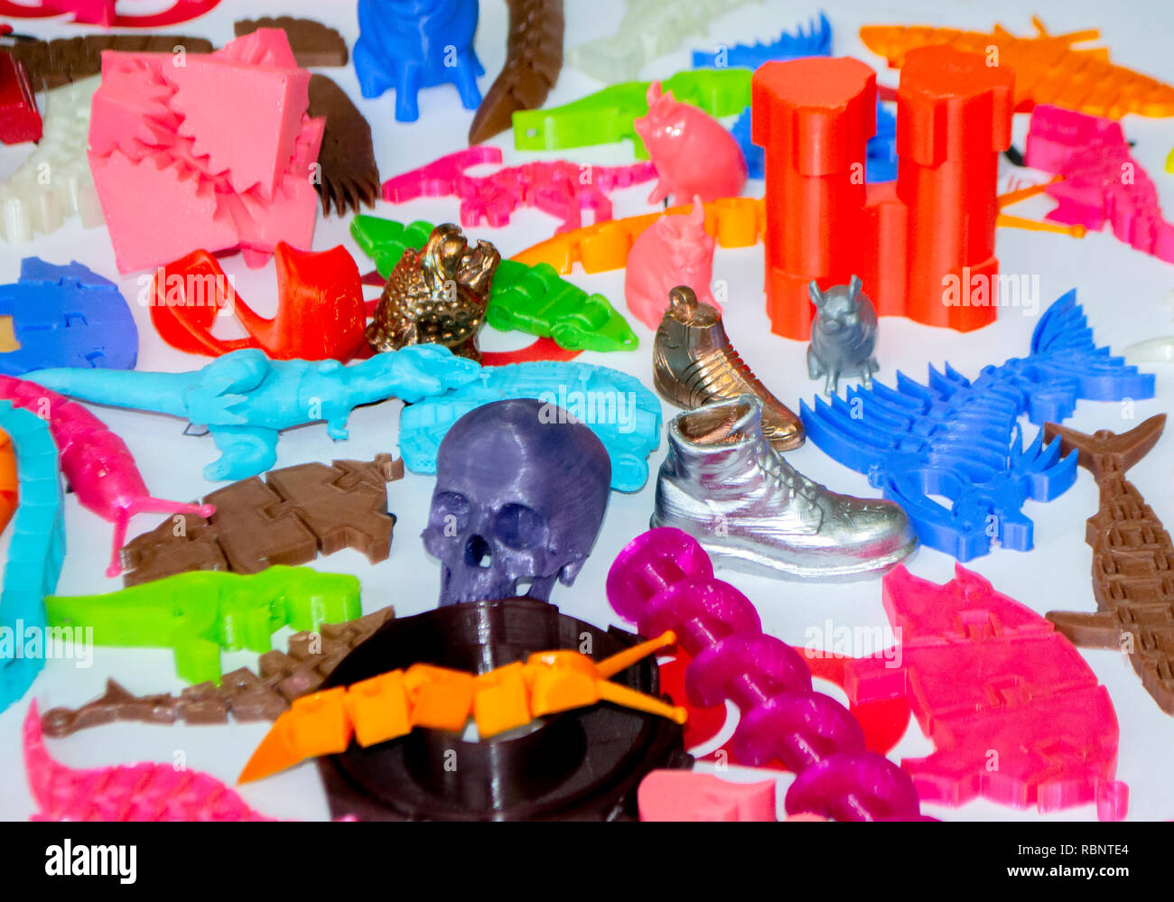 Models printed by 3d printer. Bright colorful objects printed on a 3d ...