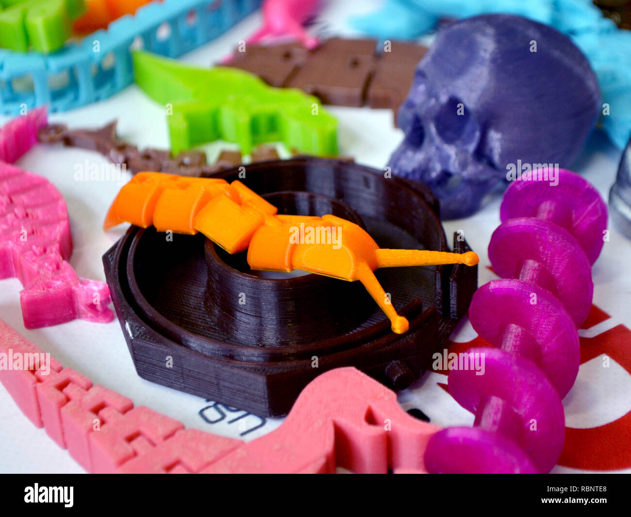 Models printed by 3d printer. Bright colorful objects printed on a 3d ...