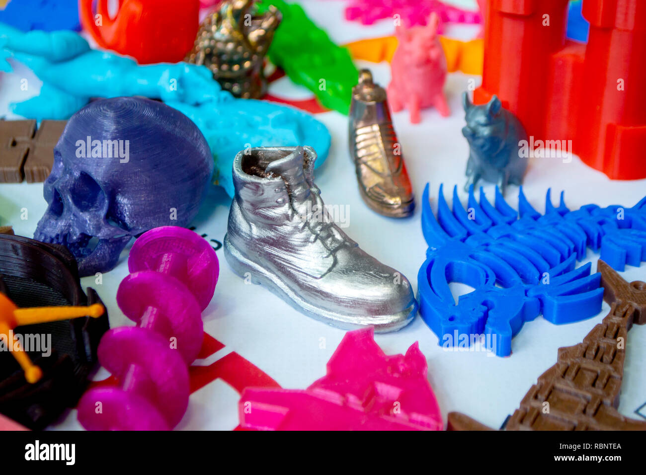 Models printed by 3d printer. Bright colorful objects printed on a 3d ...